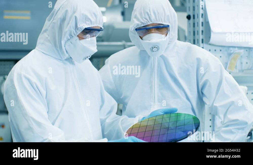Two Scientists/ Technicians in Sterile Suits Check Semiconductor ...