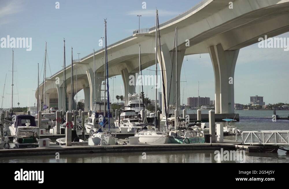 Boats anchored in a port under Causeway Bridge Stock Video Footage - Alamy