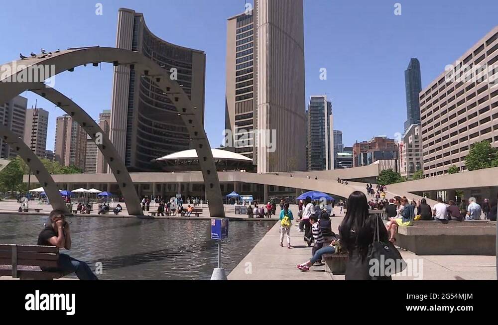 Diverse crowds of tourists in downtown urban city of Toronto on summer ...