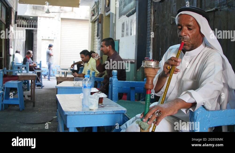 Arab Man Smoking Shisha in a traditional Cofee Shop Stock Video Footage ...