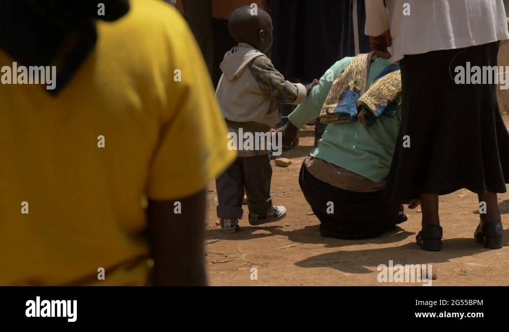 Disabled African mother and her child walking Stock Video Footage - Alamy