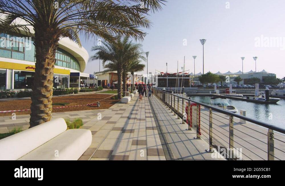 People walking on the waterfront in Yas Marina, Abu Dhabi Stock Video ...