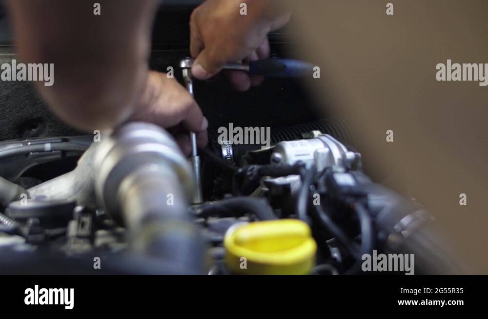 mechanic working on car engine 4k Stock Video Footage - Alamy