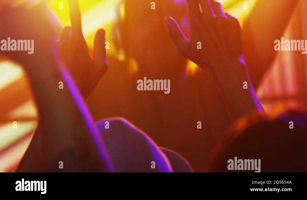 DJ Playing Music in Nightclub, People Dancing, Having Fun and Raising ...