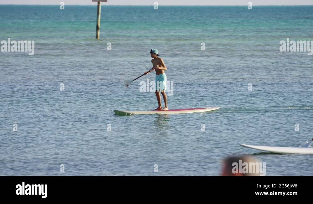 Paddle surfing Stock Videos & Footage - HD and 4K Video Clips - Alamy