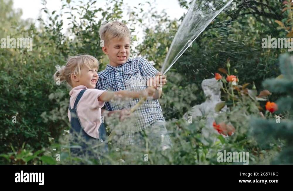 Watering children Stock Videos & Footage - HD and 4K Video Clips - Alamy