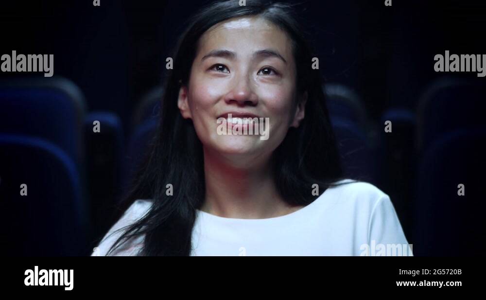 A beautiful scene in a movie causes a young Chinese woman to cry happy ...