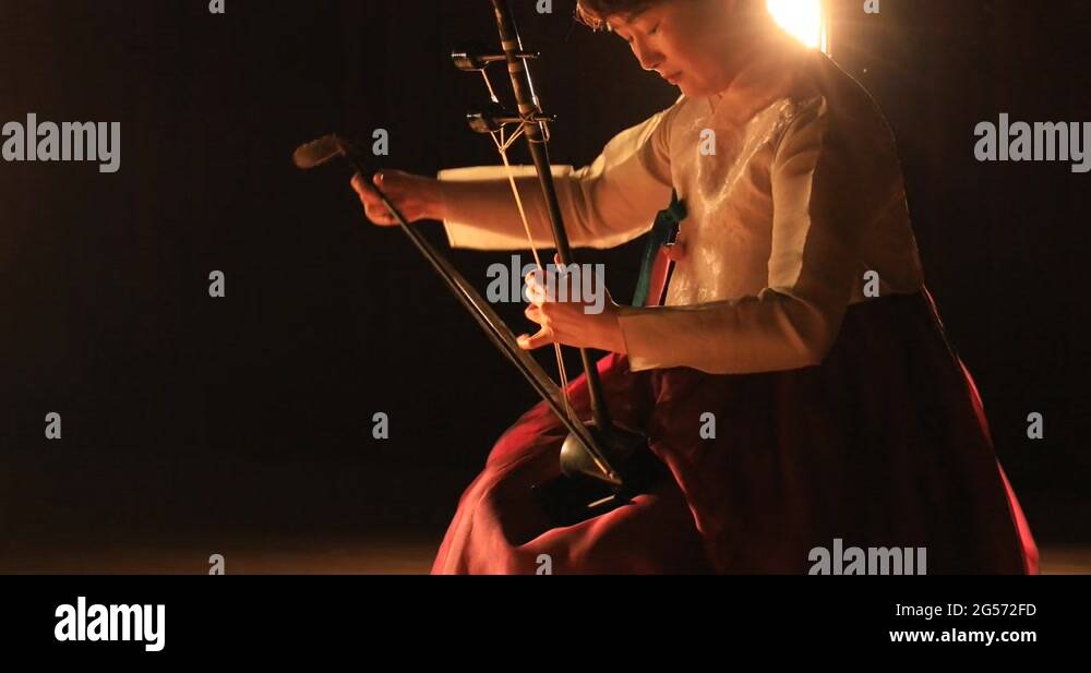 Korean female musician playing the Haegeum, Korean traditional string ...