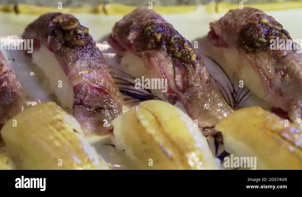 seared flounder, flatfish and wagyu beef aburi nigiri sushi Stock Video ...