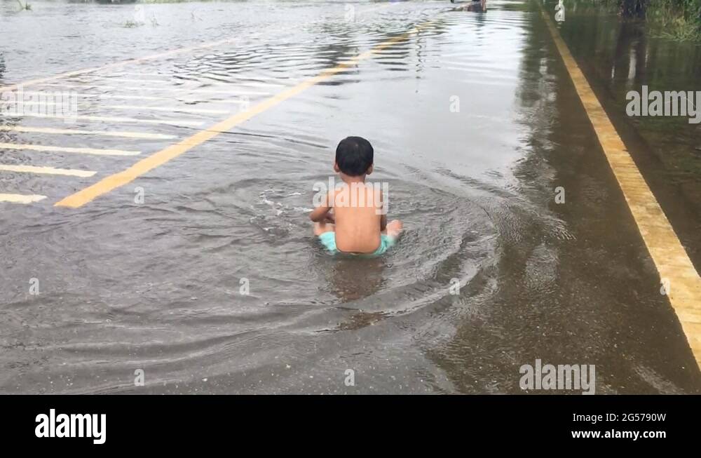 Boy flood water Stock Videos & Footage - HD and 4K Video Clips - Alamy