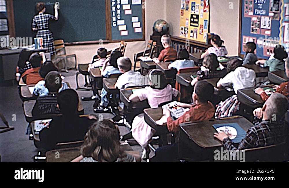 1960s Teacher Writes on Blackboard Students School Classroom Vintage ...
