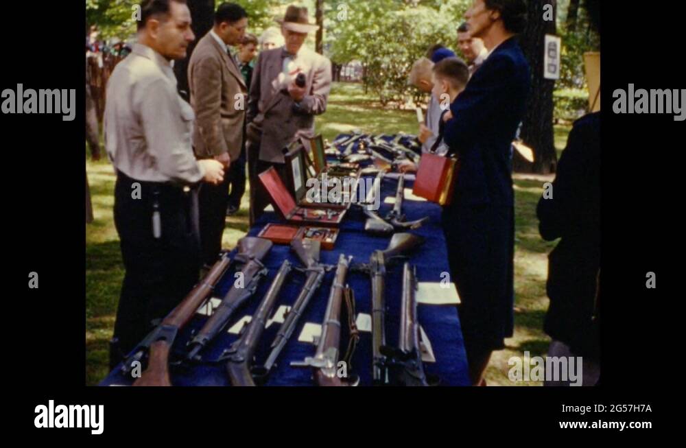 1950's: Park scenes: man poses by powder horn collection; men display ...