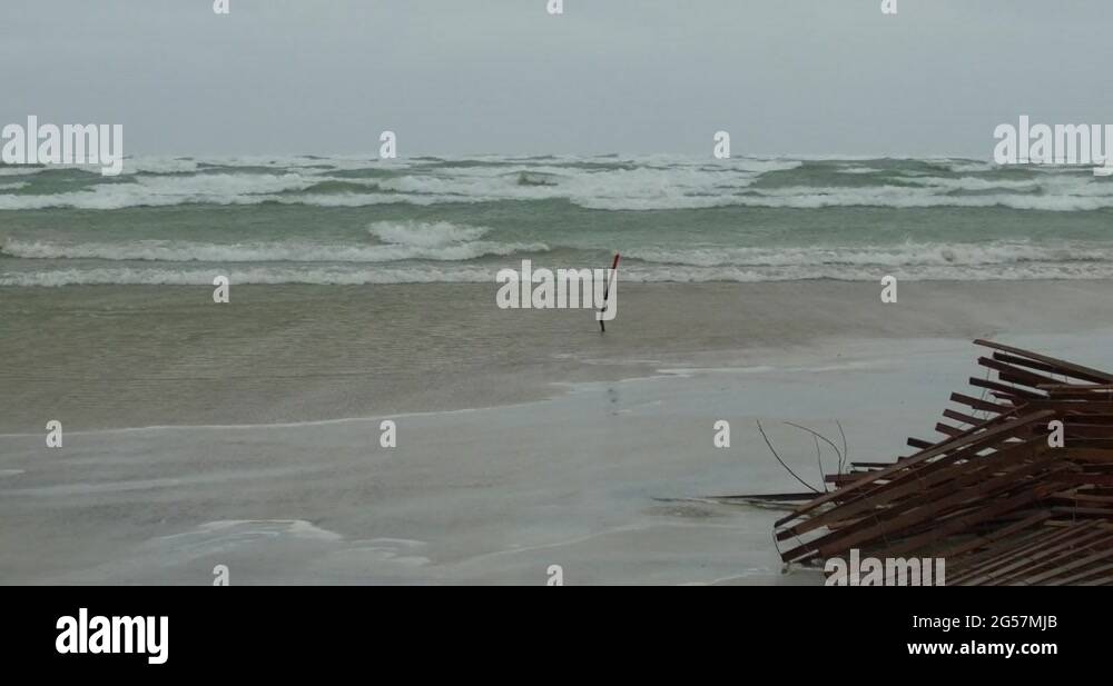 Beach flooding coastline erosion and waves in storm with hurricane ...