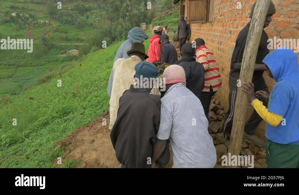 African men carrying a big pot Stock Video Footage - Alamy