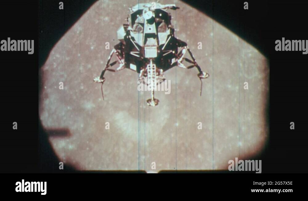 1970s command module floats in space. lunar module flies over surface ...