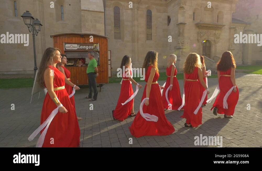 Women in red dresses on a parade Stock Video Footage - Alamy