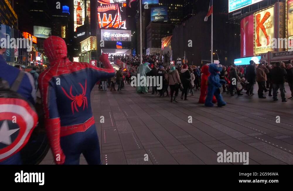 Street performers and visitors in Times Square Stock Video Footage - Alamy