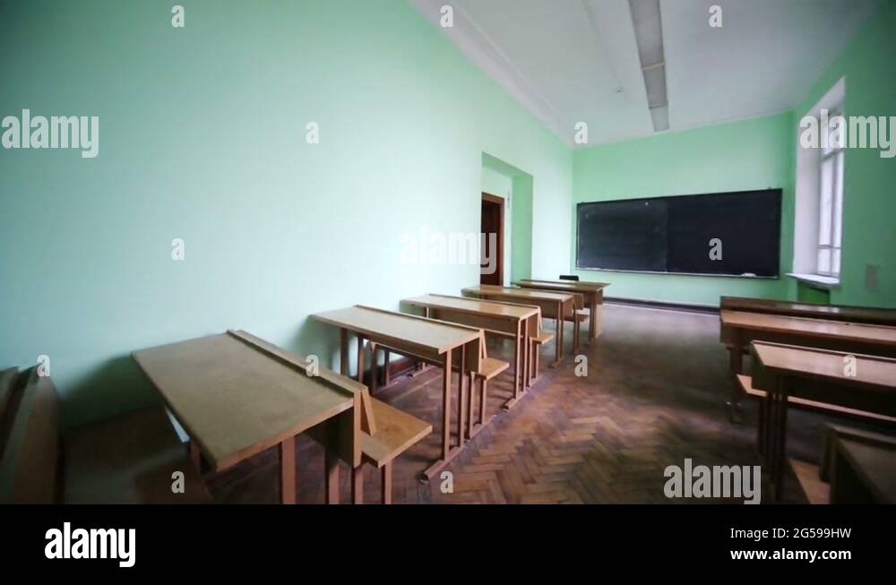 Empty small classroom with wooden desks and green walls Stock Video ...