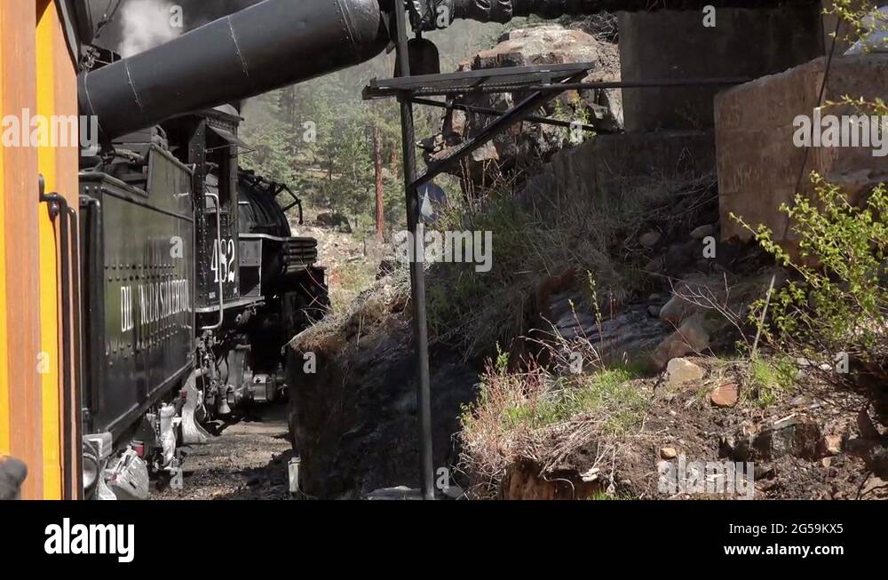 Historic steam engine loading water for steam 4K 132 Stock Video ...