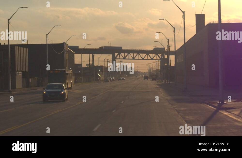 CLOSE UP Traffic on busy highway through Detroit industrial zone at ...