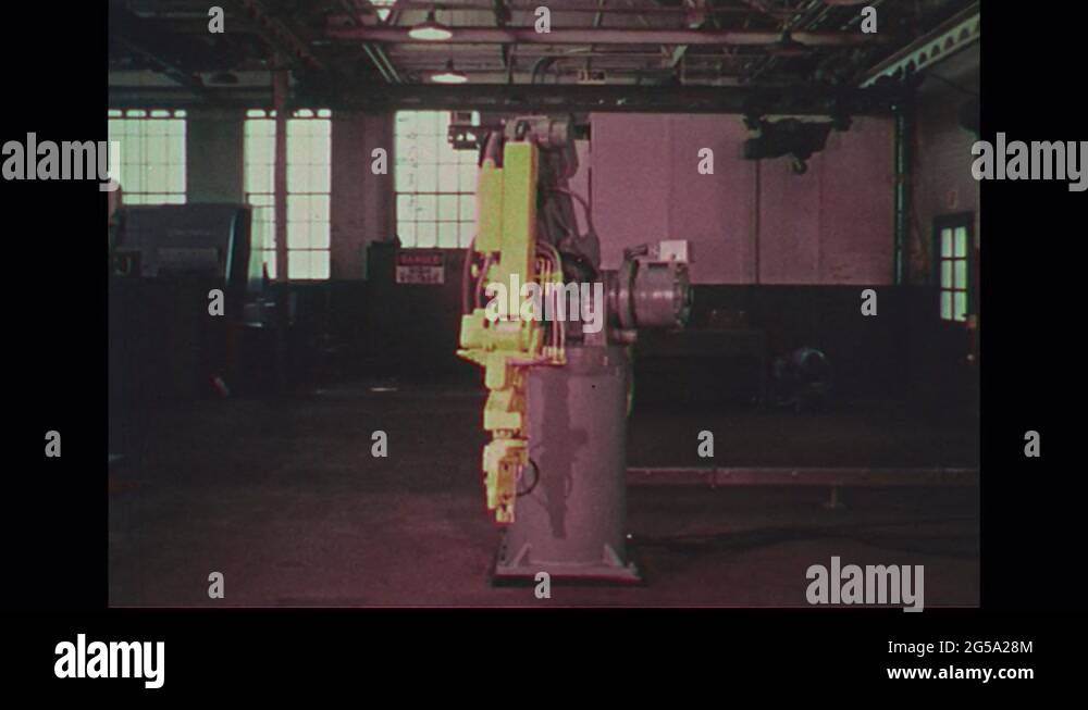 1980s: industrial robotic arm shows range motion, including ...