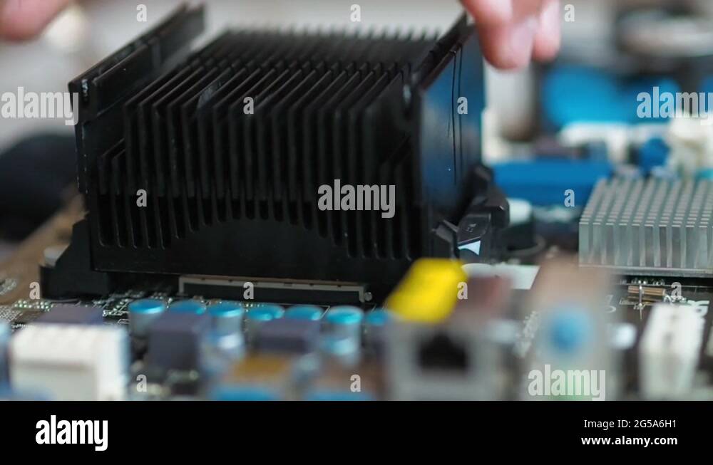 Removing And replacing CPU cooler on modern PC computer motherboard ...