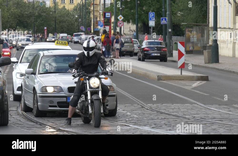 Cars and a motorcycle stopped at the traffic light Stock Video Footage ...