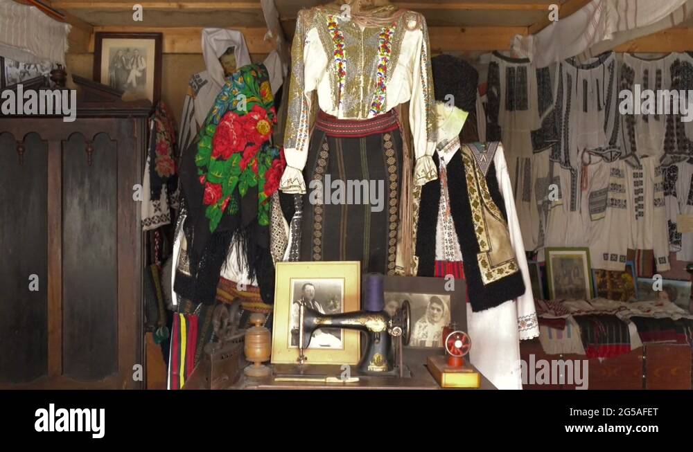 Old sewing machine, traditional clothes and pictures Stock Video ...