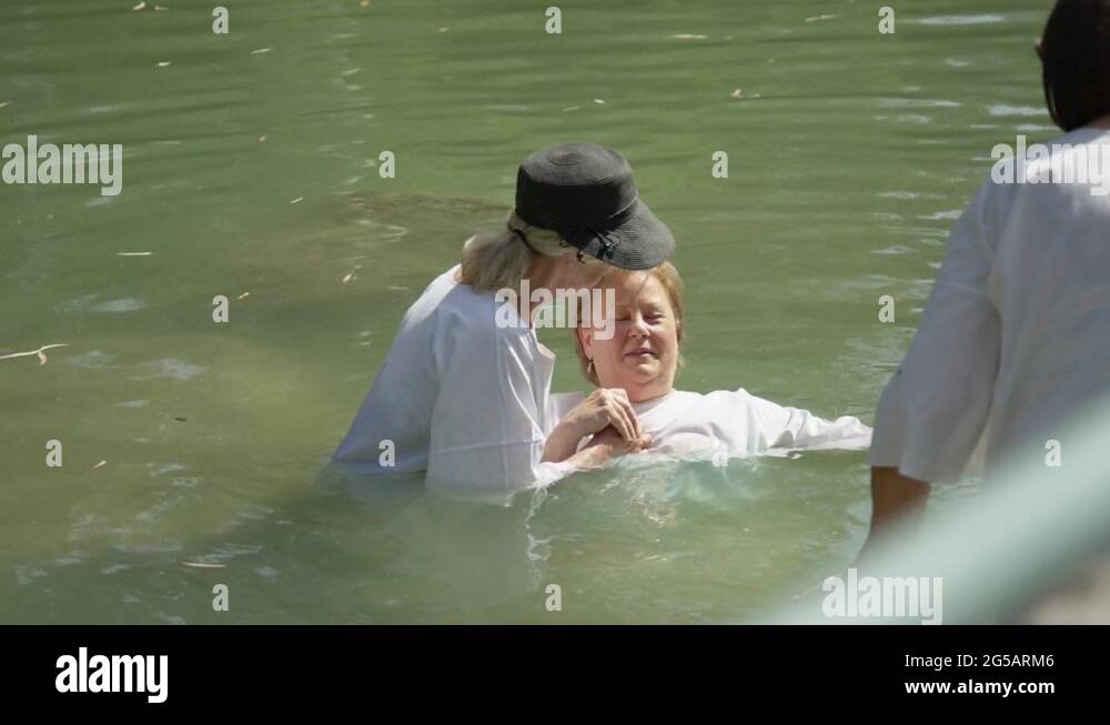 Women taking a dip in Jordan River Stock Video Footage - Alamy