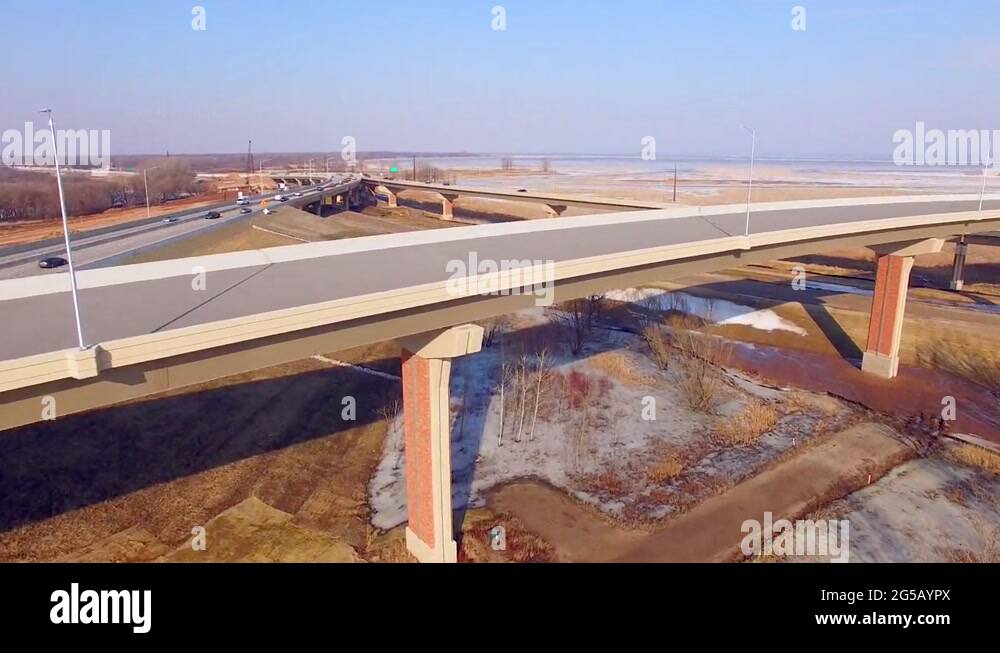 New highway overpass construction project, dynamic aerial flyover view ...