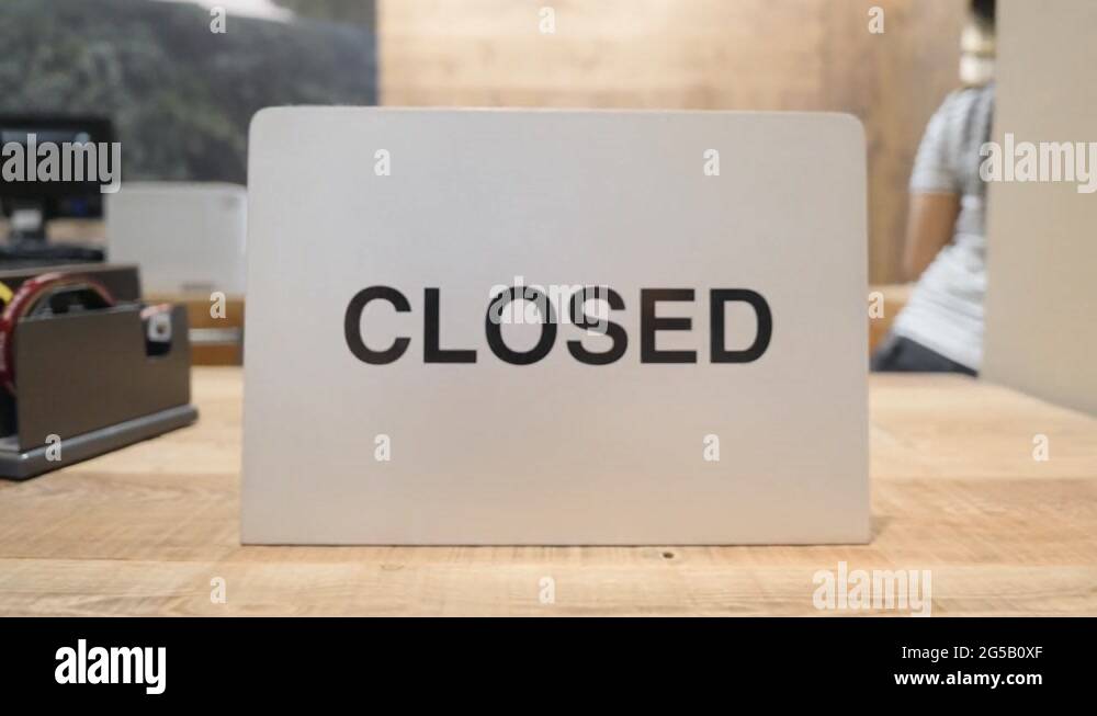 Closed Sign at the Cashier in Shopping Mall Clothing Store. 4K zoom ...