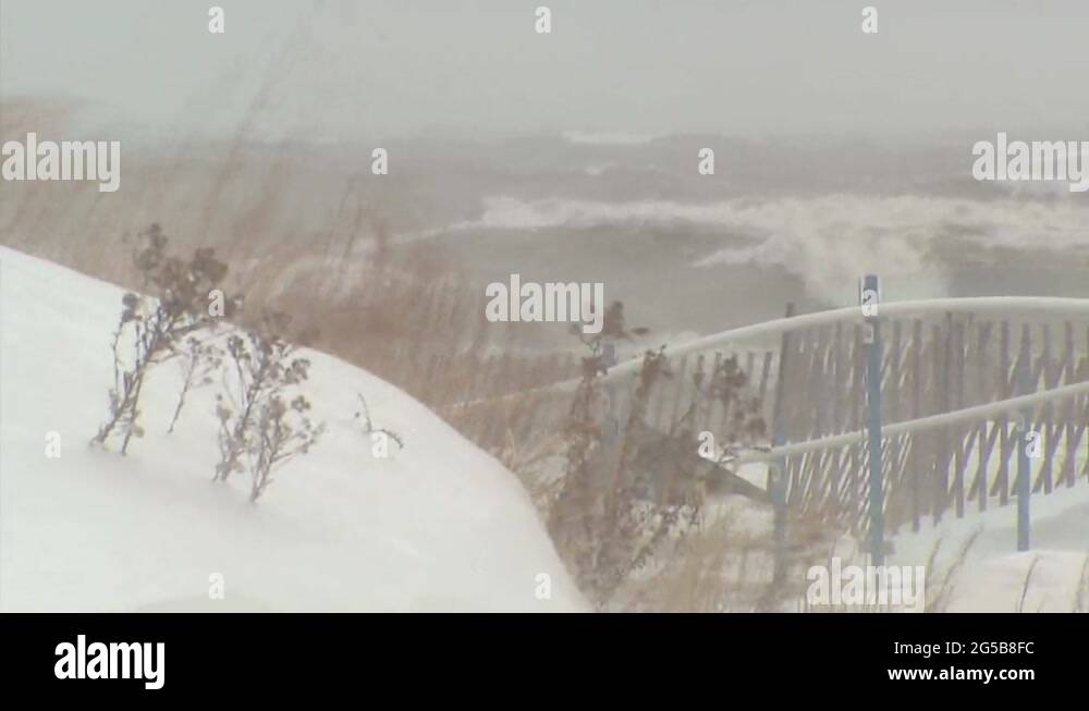 Intense waves rolling in and breaking during storm with hurricane force ...