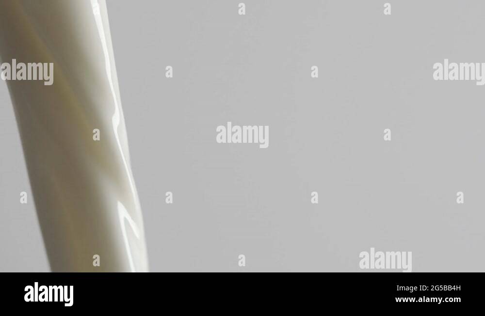 Cream pouring out on white background in super slow motion Stock Video ...