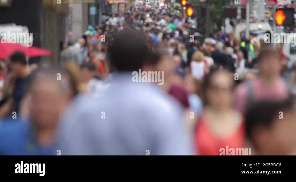 Crowd of commuter people walking street sidewalk Stock Video Footage ...