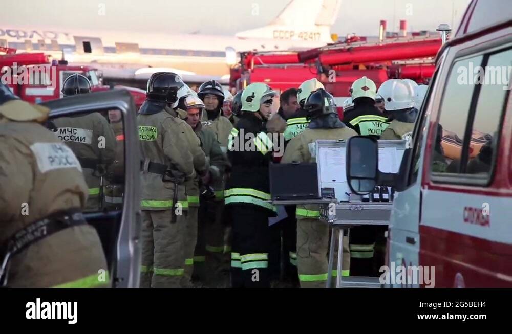 Rescuers and firefighters talking Stock Video Footage - Alamy