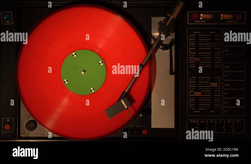 Vinyl record pleer. Plays song from an old turntable 4k top view Stock ...
