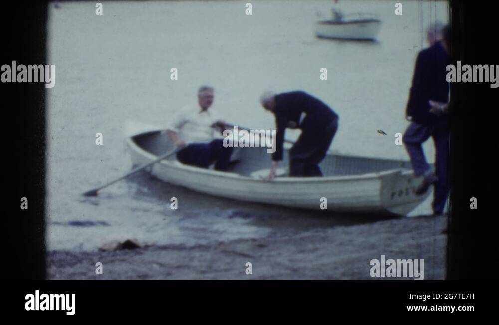 BOSTON MASS-1951: Older Men Rowing Boat In Port Water Into Flat Sandy ...