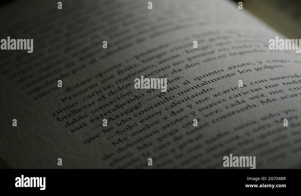 Spanish words in open book rotating at black background Stock Video ...