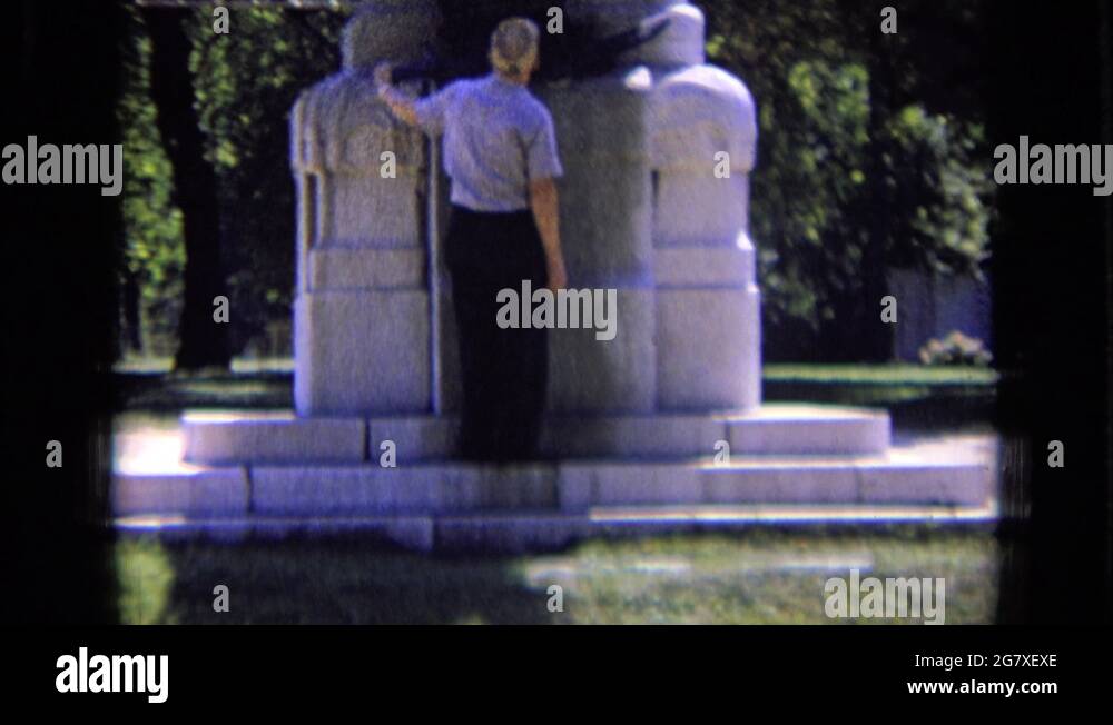 RUSSIA-1963: Man Walking Examining Base Of Stone Memorial With Statues ...