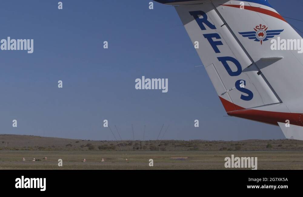 RFDS Flying Doctor airplane takes off behind tail logo at Broken Hill ...