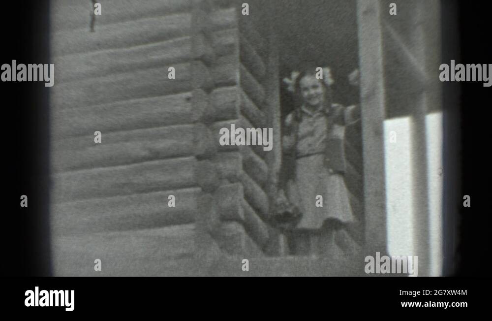 MOSCOW RUSSIA-1983: Two Story Log Cabin Second Story Women Waving First ...