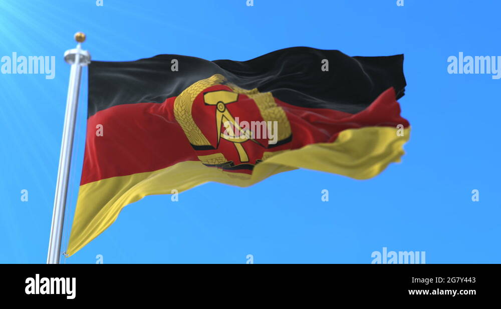 Flag of the German Democratic Republic or East Germany waving in blue ...