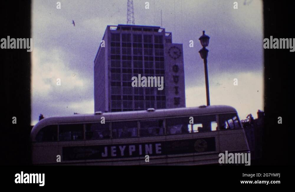 IRELAND-1969: London Tour Bus Turns Corner Of City Street Stock Video ...