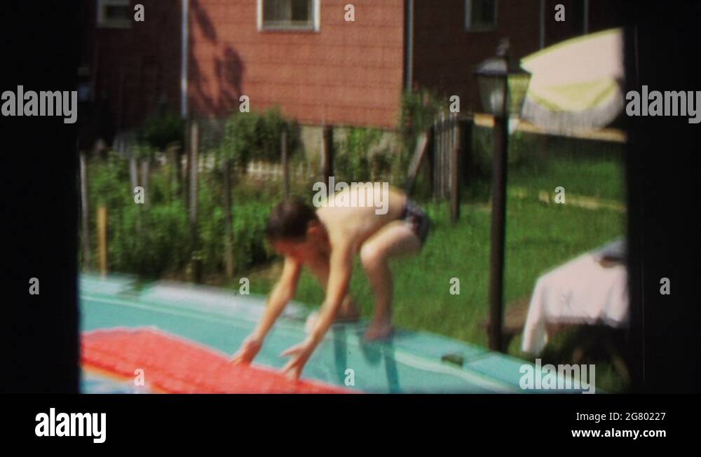 LYNBROOK NEW YORK-1971: Young Boy Jumps On To Pool And On To A Blow Up ...