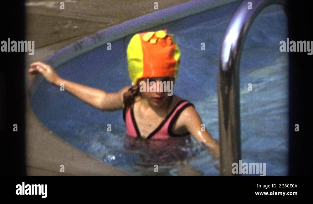 NEW YORK-1973: Young Girl Swimming In Pool Decides To Get Out Using ...