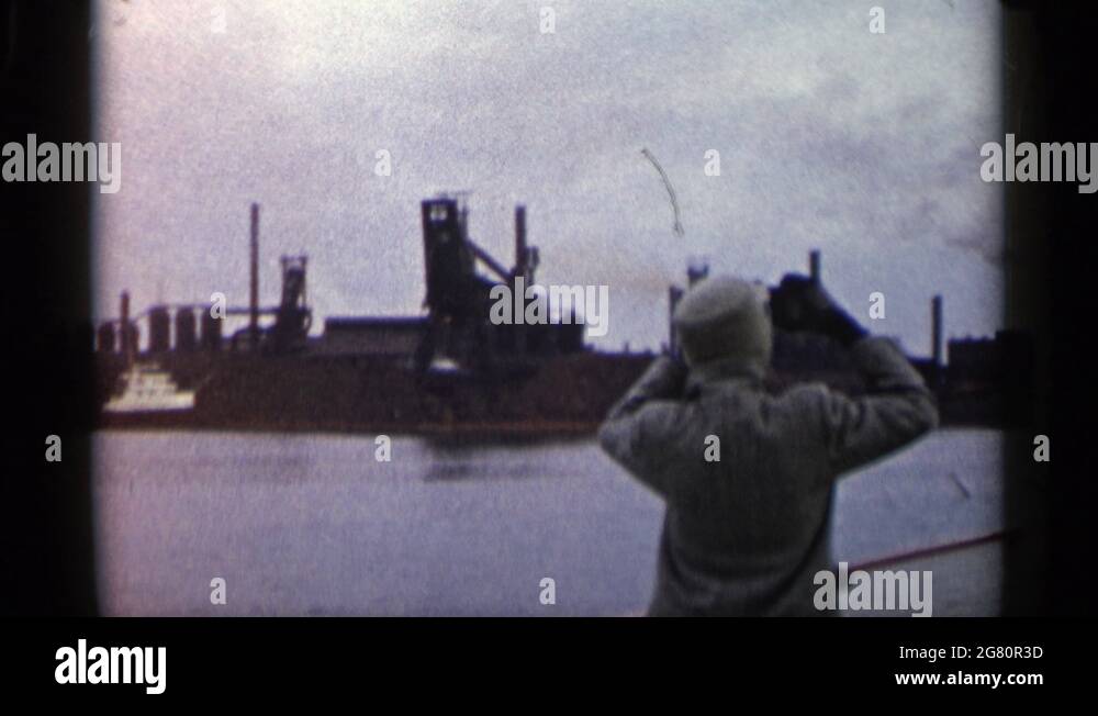 MICHIGAN USA-1960: Woman Filming Red And Black Boat Docked At Shipyard ...