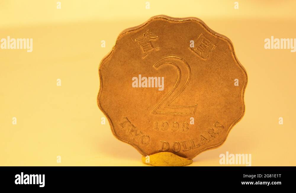 A Gold Coin On A Small Rotating Table With The Number On One Side Stock ...