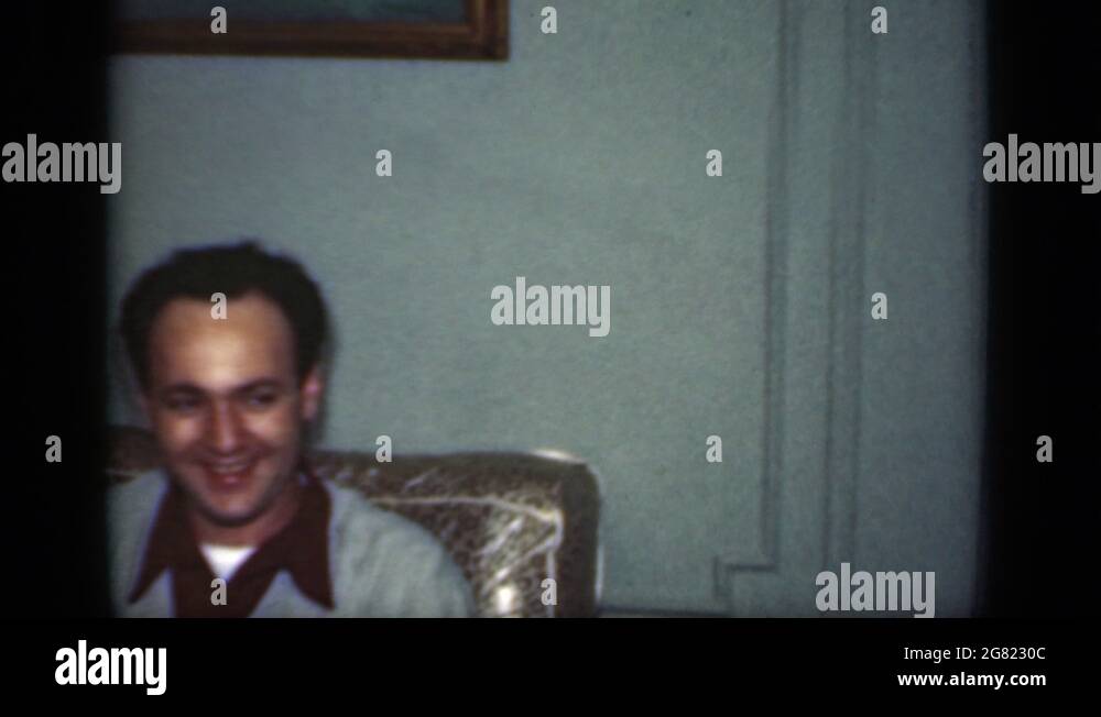 NEW YORK-1949: A Man Laughs At The Camera While Sitting On Furniture ...
