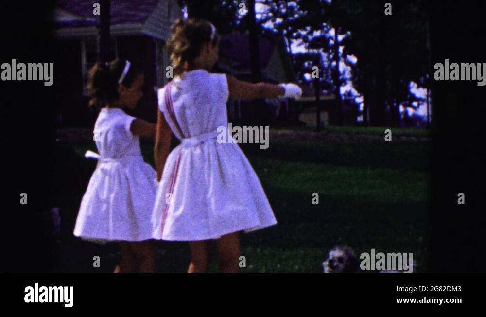 BUFFALO NEW YORK USA-1961: Two Little Girls Wearing White Dresses And ...
