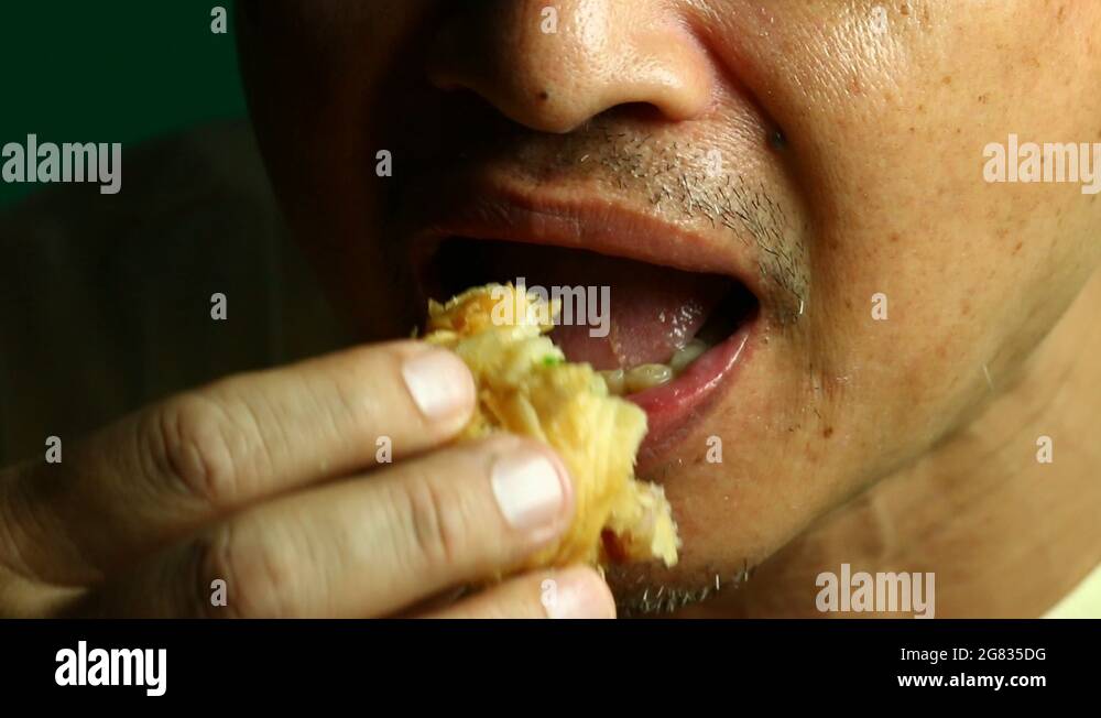 Man eating curry puff, Thai Muslim dessert Stock Video Footage - Alamy